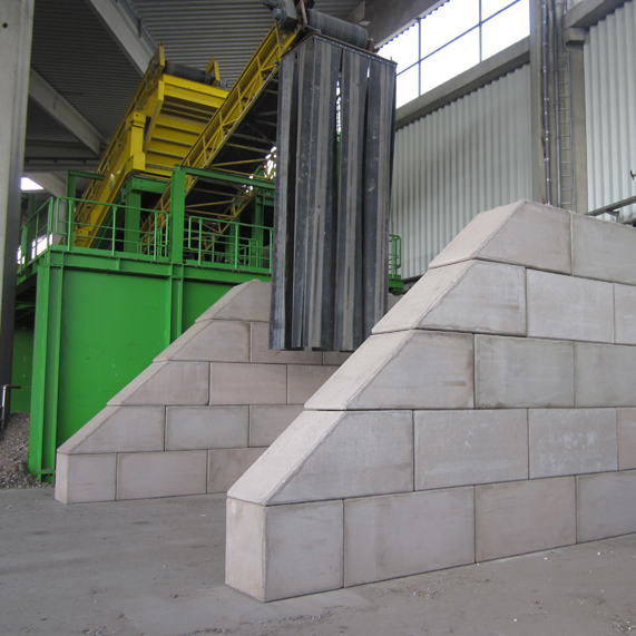 Storage bays for bulk material - concrete interlocking blocks